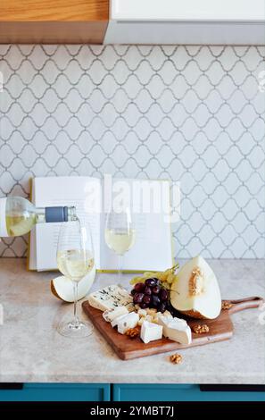 Champagne glasses, grapes and nuts on the table Stock Photo - Alamy