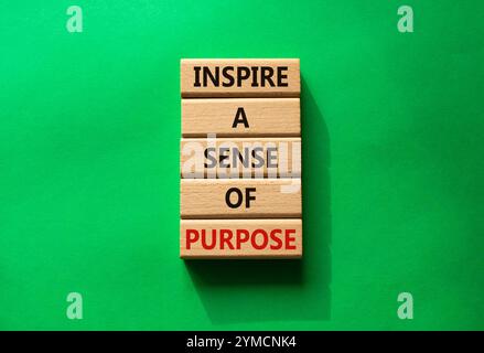 Purpose symbol. Wooden blocks with words Inspire a sense of Purpose ...