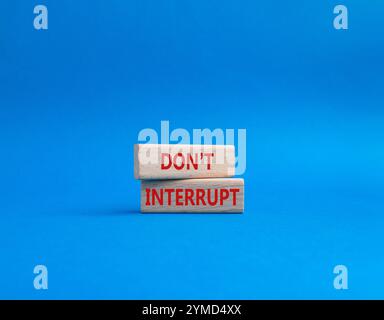 Dont interrupt symbol. Concept word Dont interrupt on wooden blocks ...