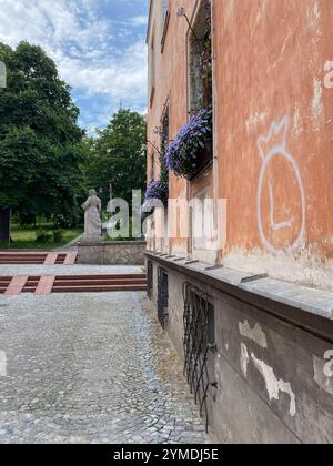Vintage wall clock with flowers and black hands on white background ...