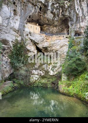 The Holy Cave of Covadonga with the fountain of the seven spouts in the ...