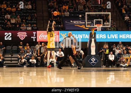 West Virginia forward Amani Hansberry (13) drives to the hoop defended ...