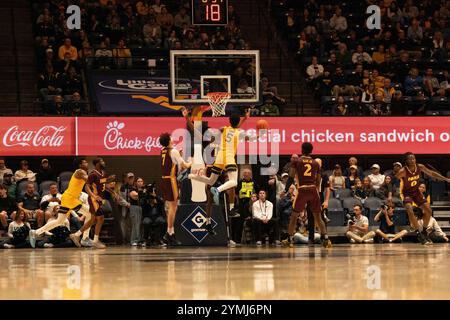 West Virginia guard Toby Okani (5) shoots over Kansas State guard Max ...