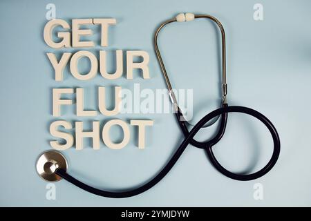 Get Your Flu Shot alphabet letters with stethoscope top view on blue ...