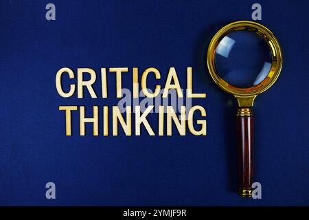 Critcal Thinking alphabet letters with gears element on navy blue ...