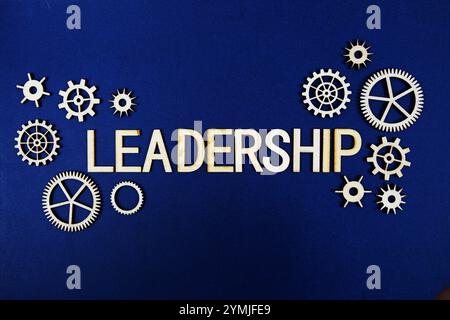 Leadership alphabet letters with gears element on navy blue background ...
