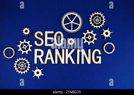 Ranking alphabet letters with gears element on navy blue background ...