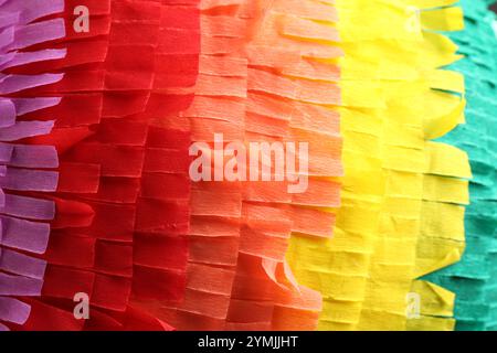 Pinata. Cut tissue paper as background, closeup Stock Photo - Alamy