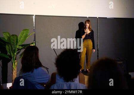 Female performer delivering a monologue on stage in an alternative ...