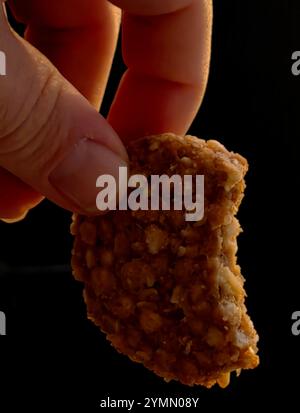 Wanna Bite? Crunchy Cookie in Focus Against Dark Background Stock Photo ...