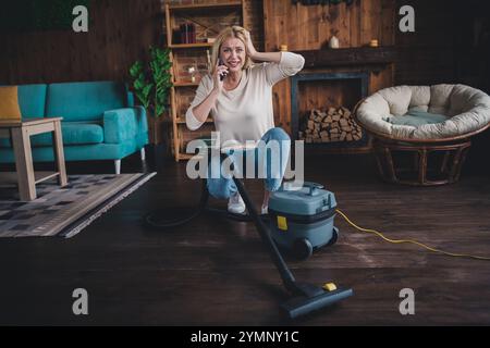 sad modern woman with smartphone doing yoga at modern green home Stock ...