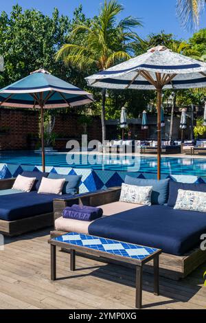 Blue deck chairs and parasols at Manarai Beach House, Sofitel, Nusa Dua ...