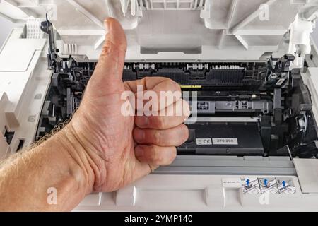 Removing a used ink cartridge from a printer in the office Stock Photo ...