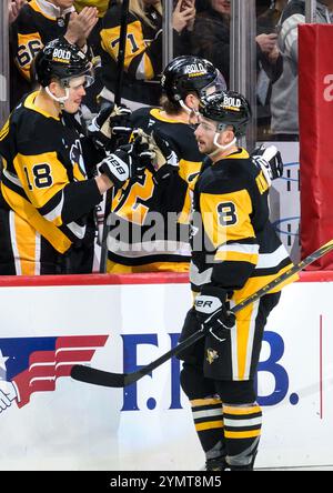 Pittsburgh Penguins left wing Michael Bunting, right, takes a shot past ...