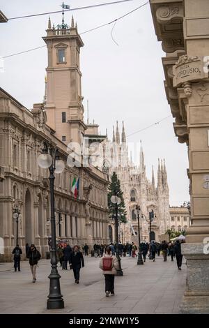 A tram in Via Orefici in the center of Milan approaching its stop at ...