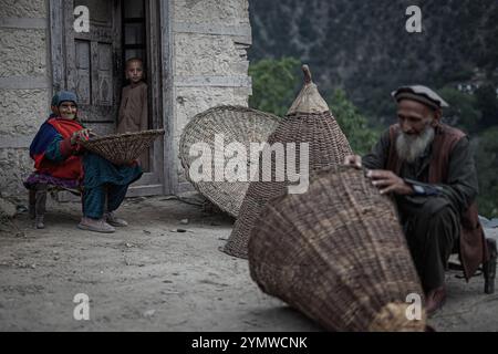 A Nuristani woman and man weaving handmade baskets Nuristan ...