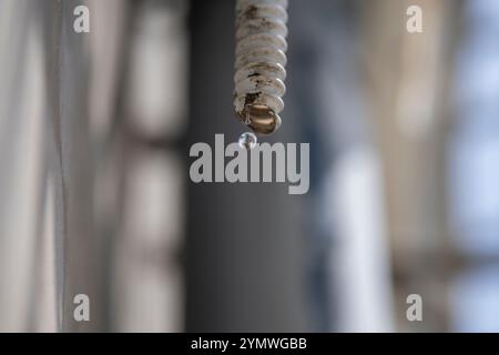 AC drain pipe dripping water on a wall Stock Photo - Alamy