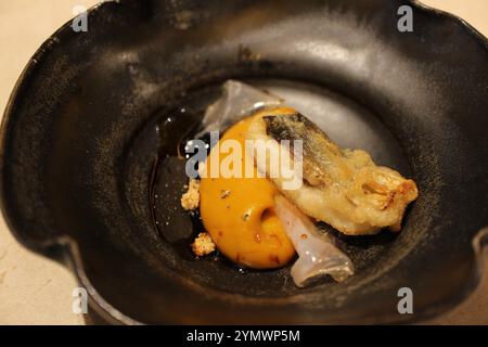 Italian cuisine: fried herring with pumpkin crema Stock Photo - Alamy