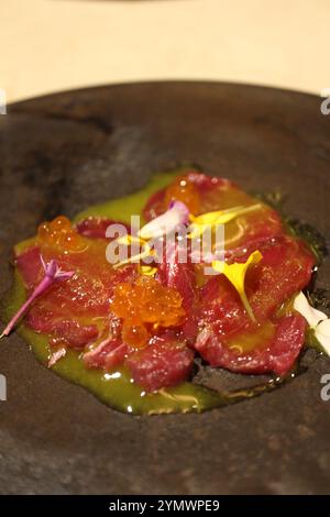 Italian cuisine: aged yellowfin tuna with pistachio sauce Stock Photo ...