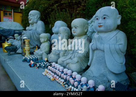 Traditional stone statues and decorative figurines inside the courtyard ...