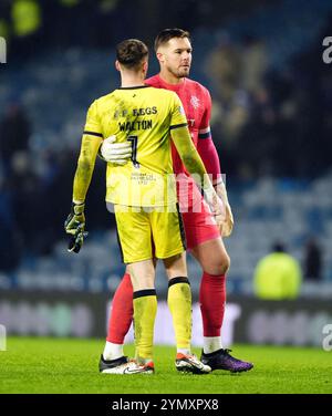Dundee United goalkeeper Jack Walton removes balls that were thrown on ...