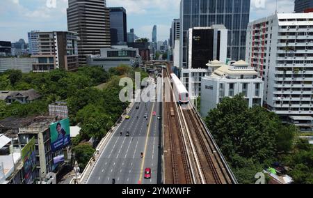 Aerial view BTS sky train runs through the street above Sukhumvit road ...