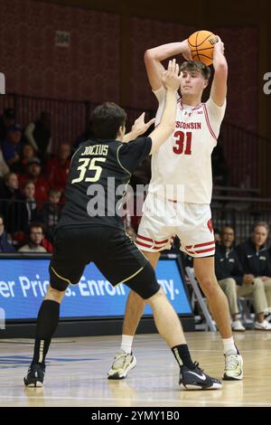Wisconsin Badgers forward Nolan Winter (31) handles the ball during a ...