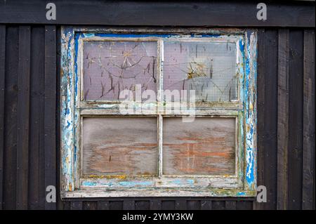 Old damaged and repaired shed window Stock Photo - Alamy