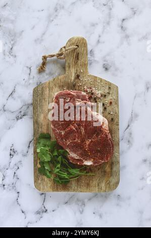 Marble pork steak, raw neck meat with thyme. Isolated on white ...