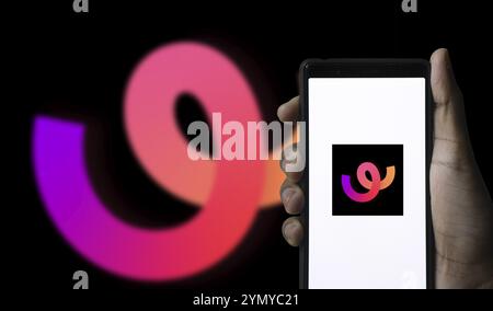 Whee logo is displayed on smartphone. Whee is a new social app owned by ...