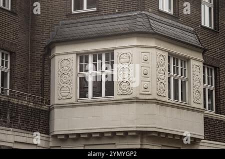 Windows with decorations of an office building over 100 years old Stock ...