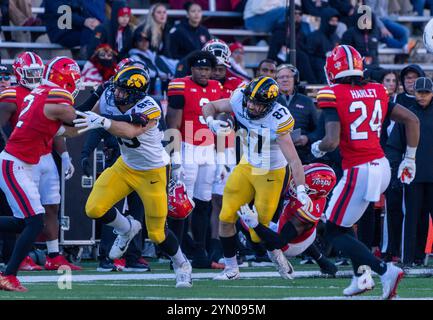 Iowa tight end Addison Ostrenga (87) makes a catch over Missouri safety ...