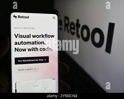 Person holding cellphone with web page of financial institution Swiss ...