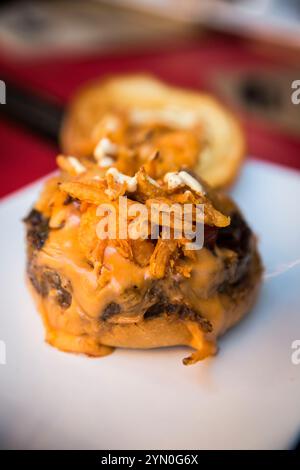 The "Manly Burger" comprised of beer-cheddar cheese, bacon lardons ...