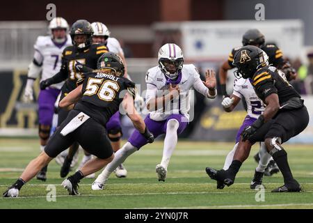 James Madison quarterback Alonza Barnett III, right, rushes for a ...