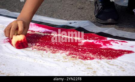 Making splash batik (batik ciprat). Batik is a type of cloth motif ...