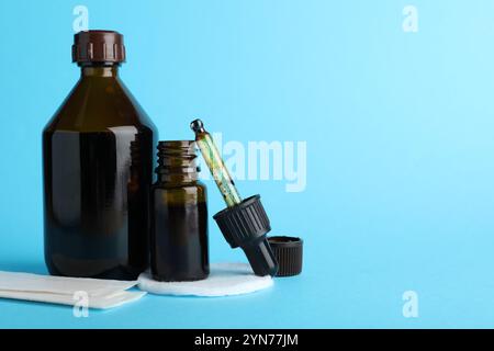 Topical iodine and bandages on light blue background Stock Photo - Alamy