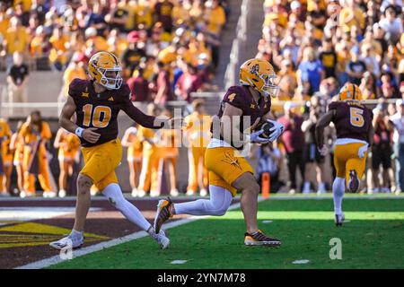 Cam Skattebo and Arizona State quarterback Sam Leavitt (10) watch from ...