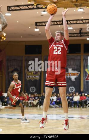 Wisconsin Badgers forward Steven Crowl (22)scores against UCLA Bruins ...