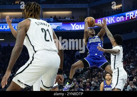 Brooklyn Nets guard Keon Johnson (45) shoots over Charlotte Hornets guard Vasa Micic during the ...