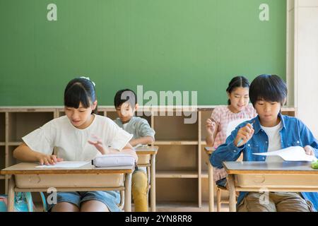 Primary school students studying seriously Stock Photo - Alamy