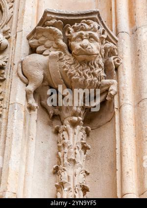 A detailed winged creature adorns the facade of an ancient building in ...