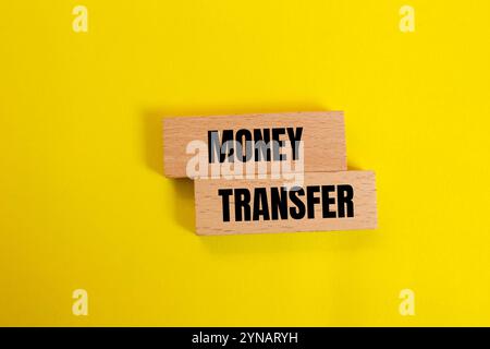 Wooden blocks with symbol of money transfer concept Stock Photo - Alamy