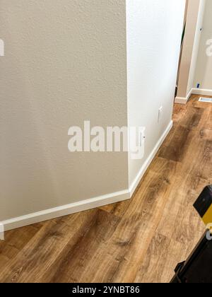 Installing Vinyl Floors and PVC Baseboards Stock Photo - Alamy