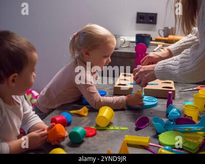 preschool child playing with molding shapes Stock Photo - Alamy