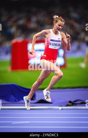 Alicja Konieczek participating in the 3000 metres steeplechase at the Paris 2024 Olympic Games ...