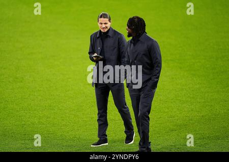 Feyenoord's Anis Hadj Moussa, left, challenges for the ball with AC ...