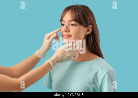 Surgeon hands touching happy woman's nose before plastic surgery on ...