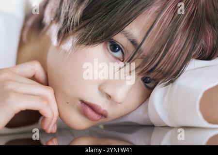 Japanese Woman Laying On A Table Stock Photo - Alamy