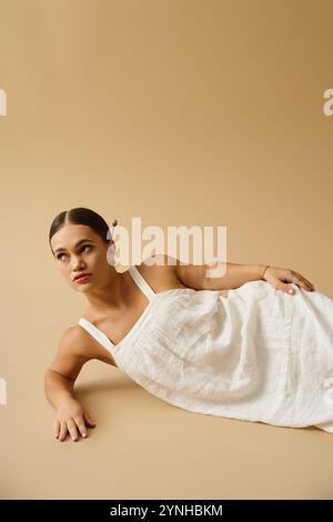Charming young woman with short stature poses gracefully in elegant ...